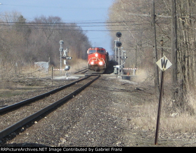 CN 2719 Finally leaves the main and comes up to the camera while zoom in to the train coming and ...